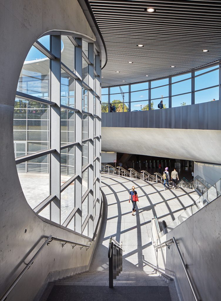 Curvilinear concrete supports contribute to an open, airy atmosphere ...